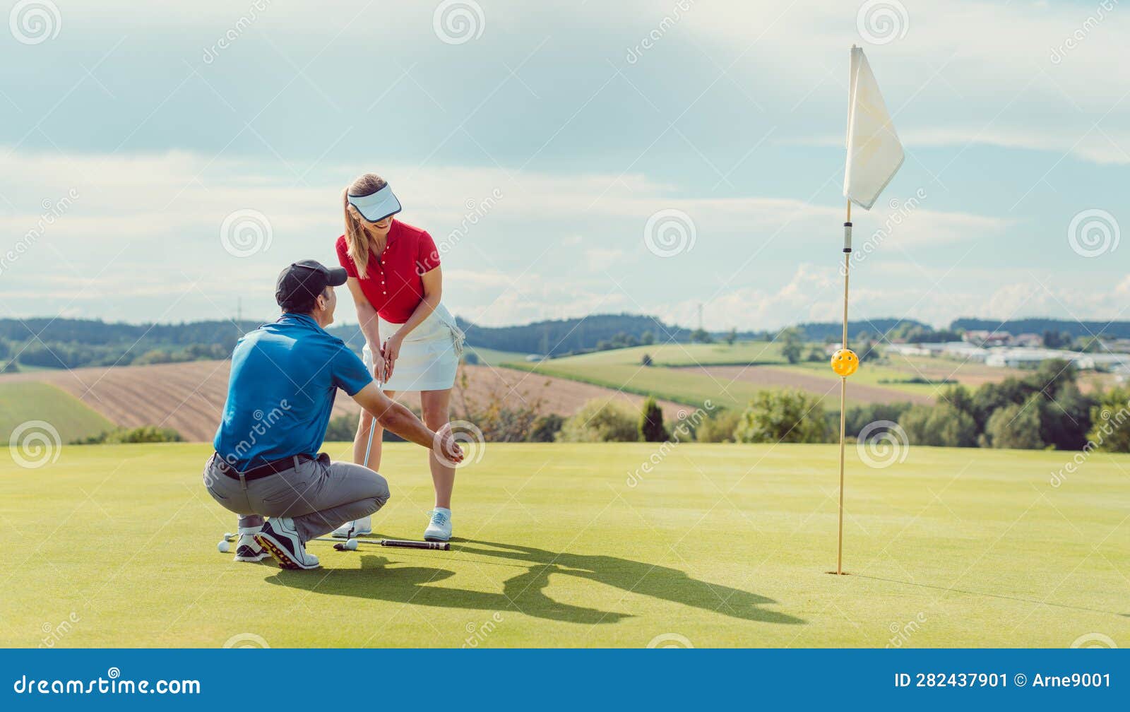 Pro on Golf Course Teaching a Woman How To Put Stock Image - Image of ...