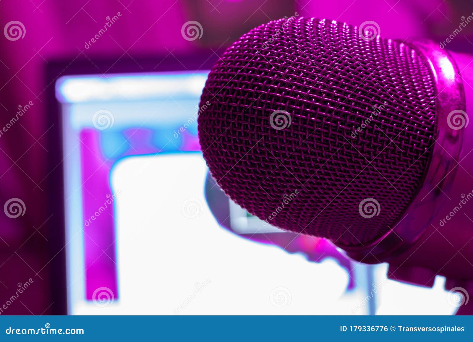 Pro Microphone for Broadcast with Laptop on Background in Purple Light ...