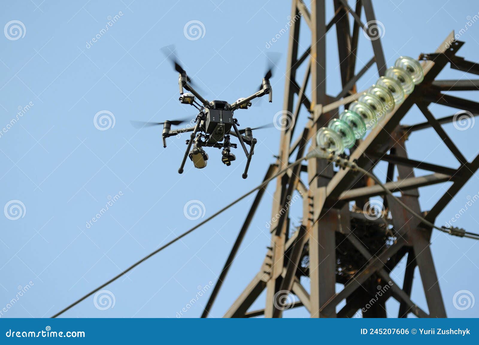 Pro Quadcopter with Camera Aboard Flying in a Sky, Electric Pylon ...