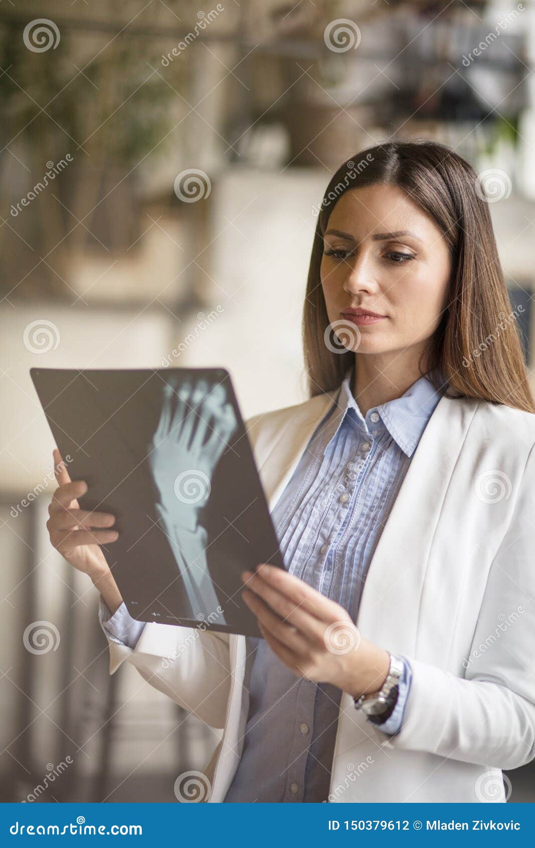 She is a Pro at Reading X-rays Stock Photo - Image of fracture ...