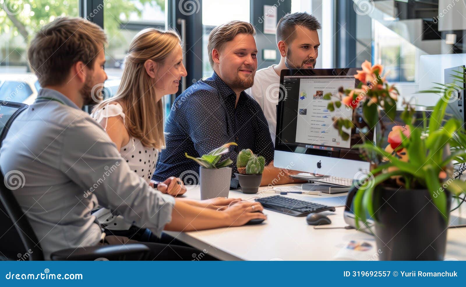 Proactive Office Team in Modern Workspace with Computer, Fostering ...