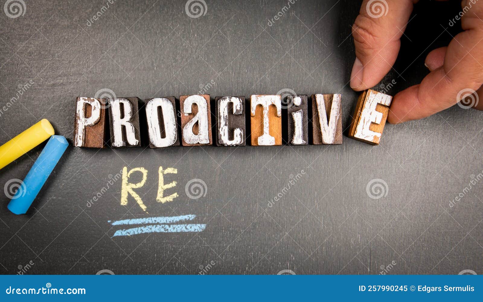 Proactive and Reactive Concept. Wooden Letter Blocks and Colored Chalk ...
