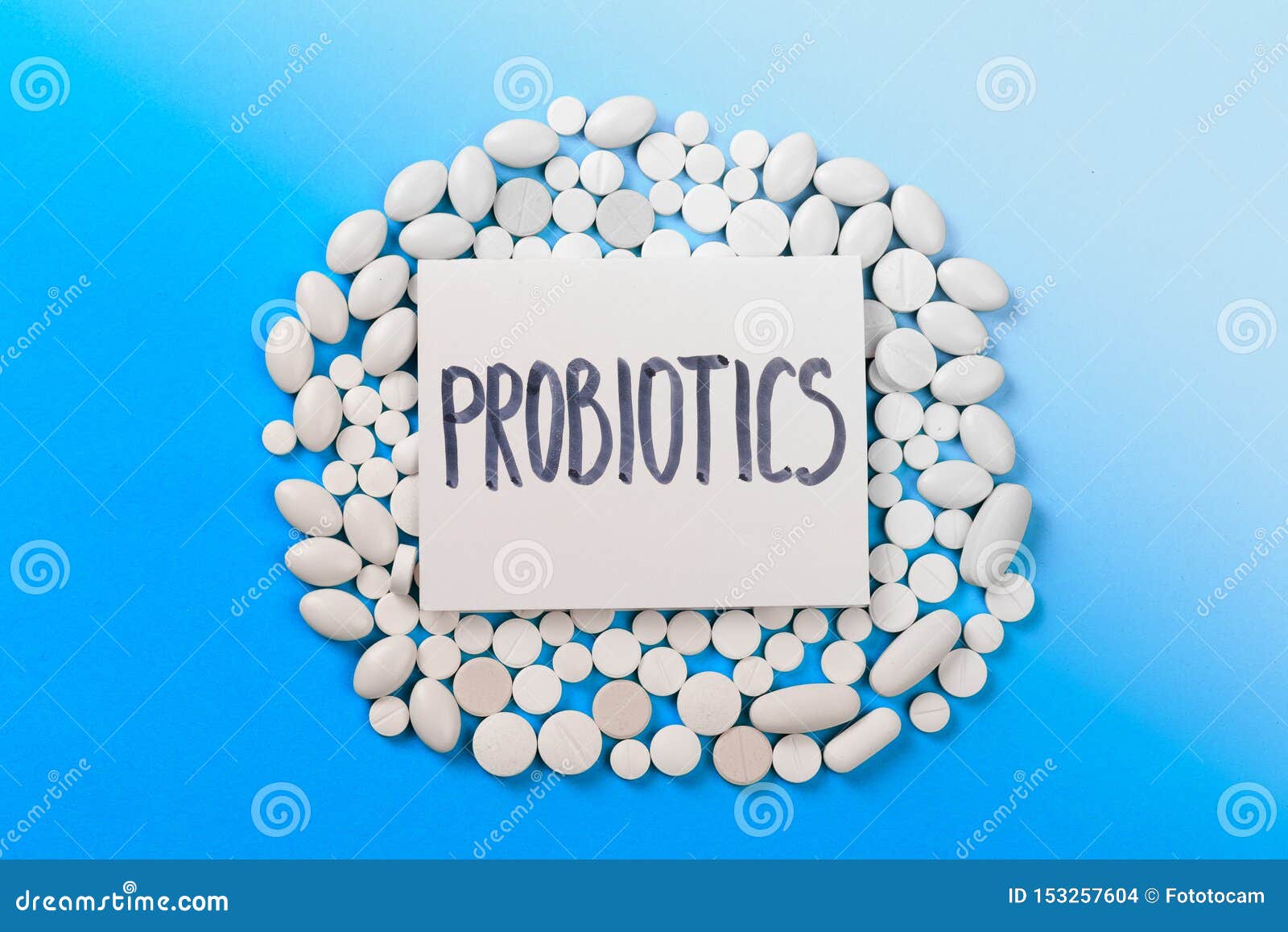 Probiotics White Dragee on Blue Background - Image Stock Photo - Image ...