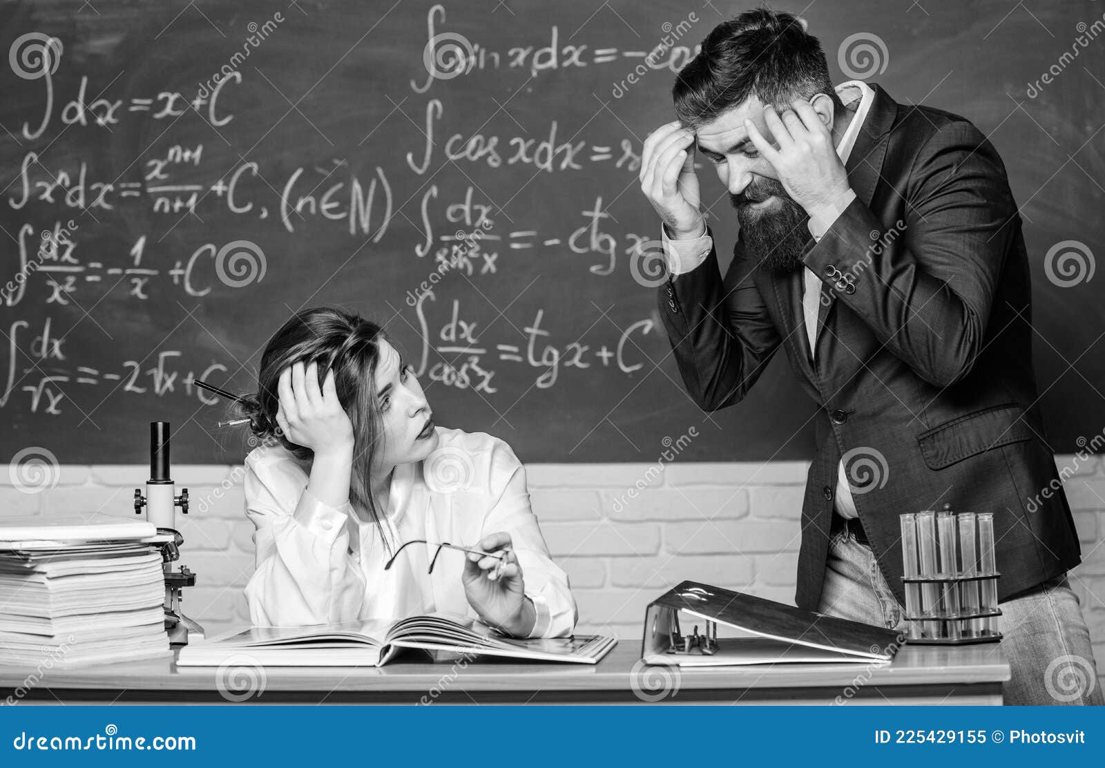 Problem Solving. Bearded Man and Woman Consider Problem at Lesson ...