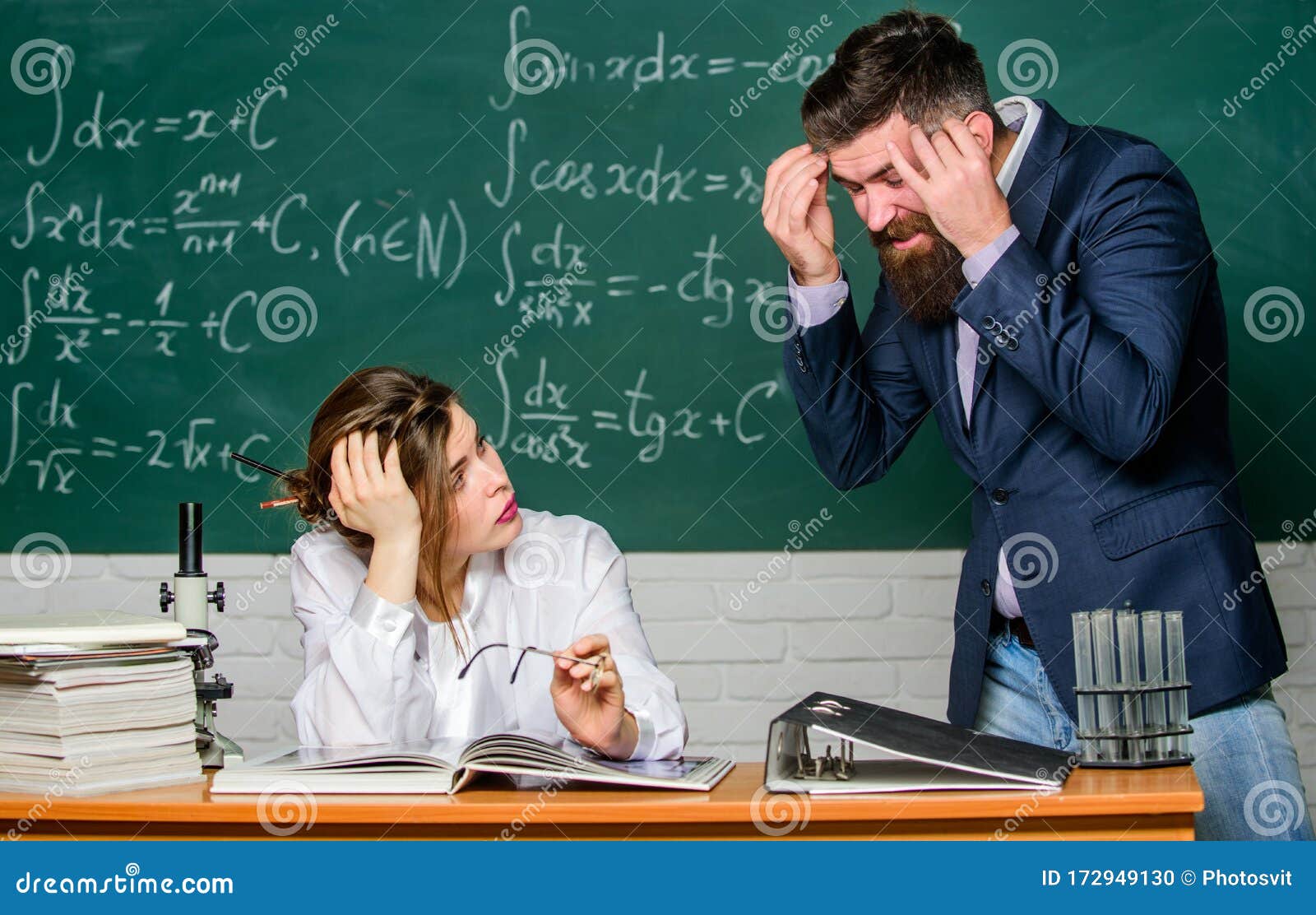 Problem Solving. Bearded Man and Woman Consider Problem at Lesson ...