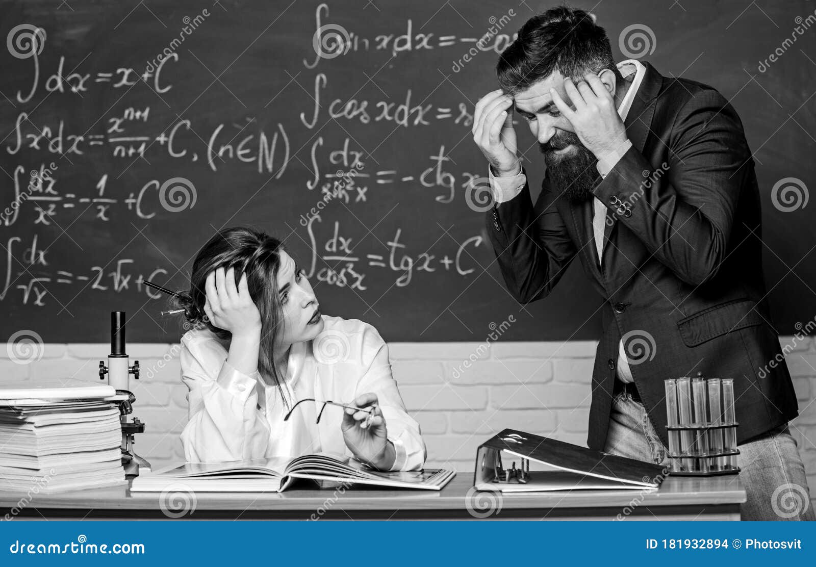 Problem Solving. Bearded Man and Woman Consider Problem at Lesson ...