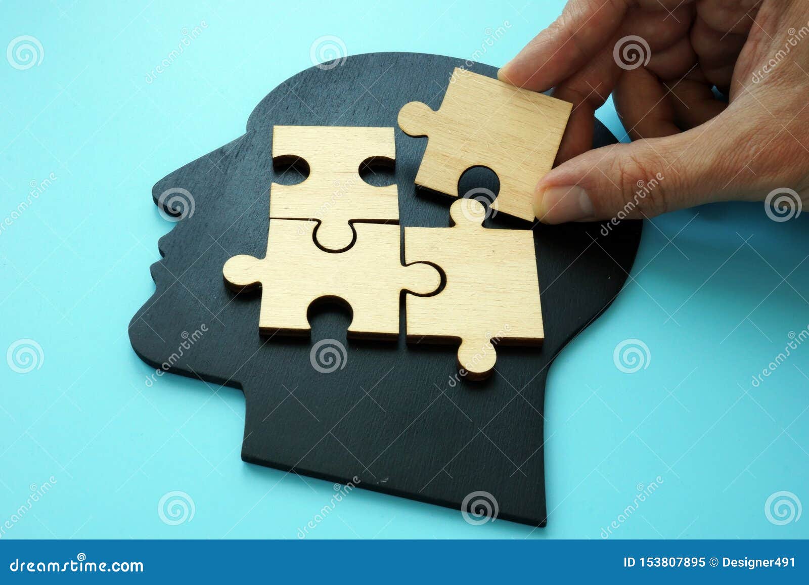 Problem Solving Concept. Hand Puts Piece of Puzzle on Head Shape Stock ...