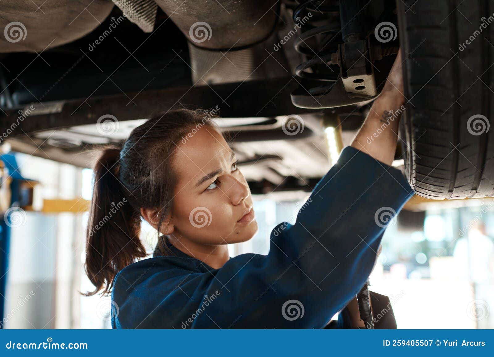 Problem Solving is a Huge Part of the Job. a Female Mechanic Working ...