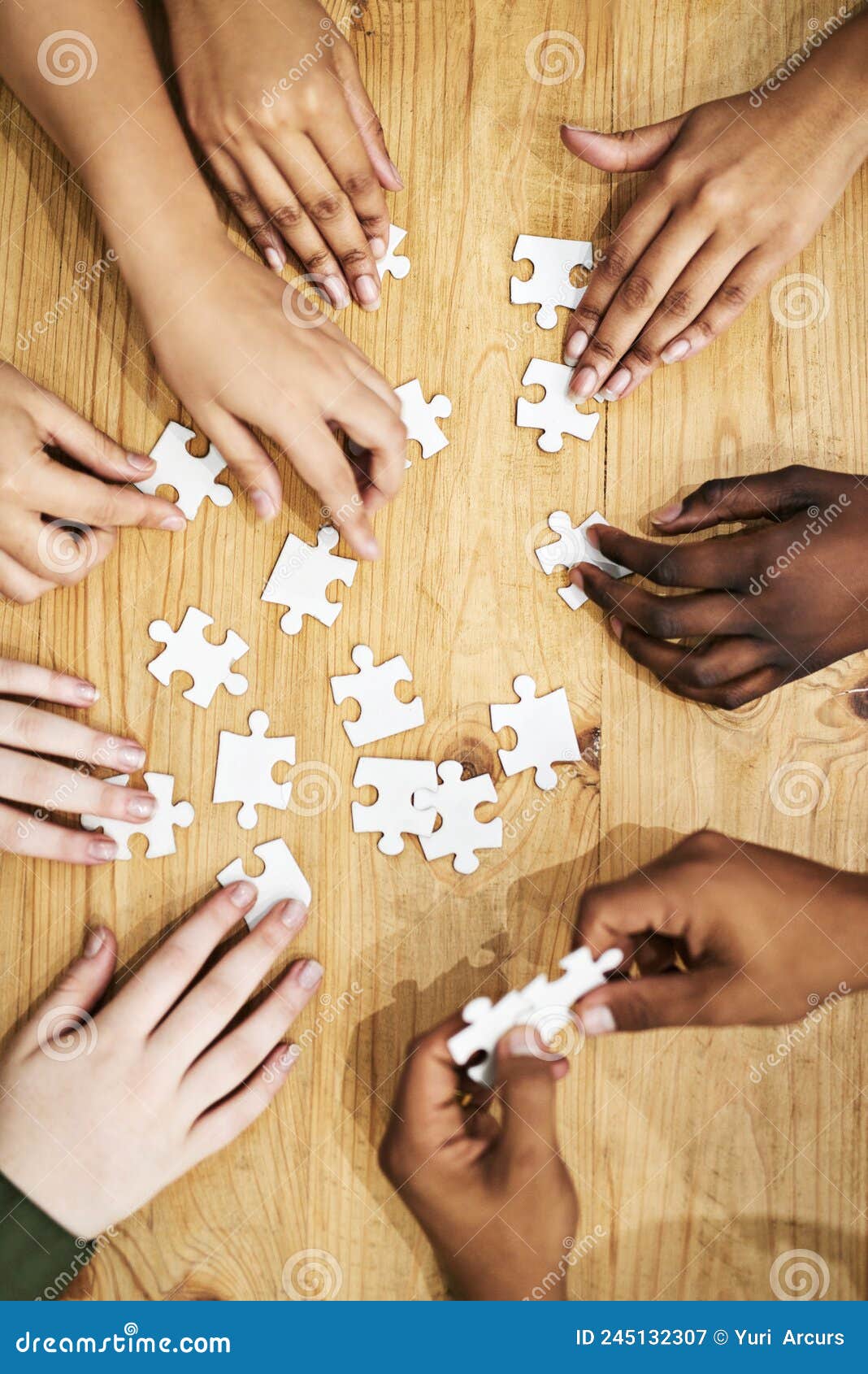 Problem Solving Like Pros. Shot of a Group of People Building a Puzzle ...