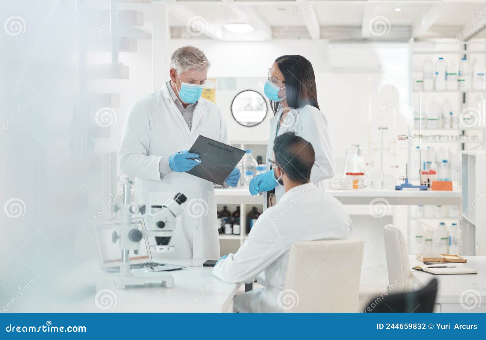 Problem Solving is What they Do Best. Shot of a Group of Scientists ...