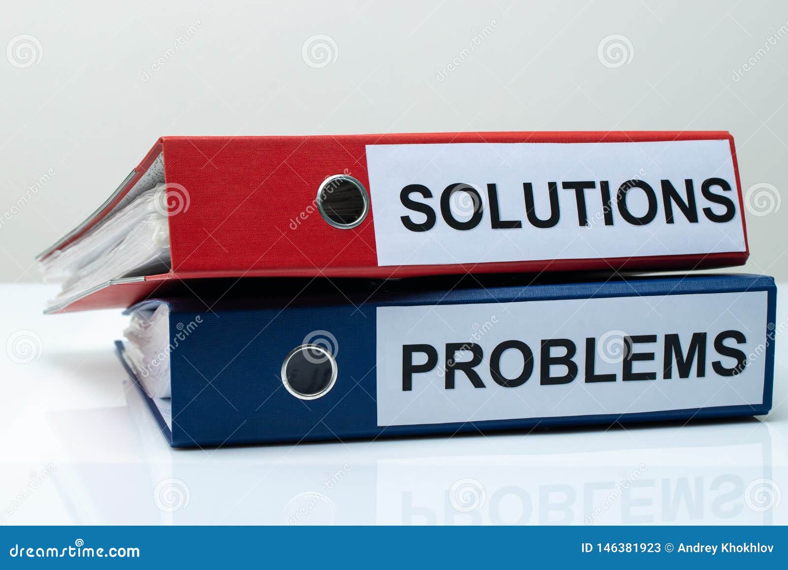 Problems and Solutions - Two Binders with Text on Desk in the Office ...