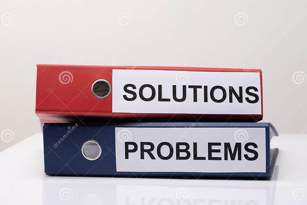 Problems and Solutions - Two Binders with Text on Desk in the Office ...