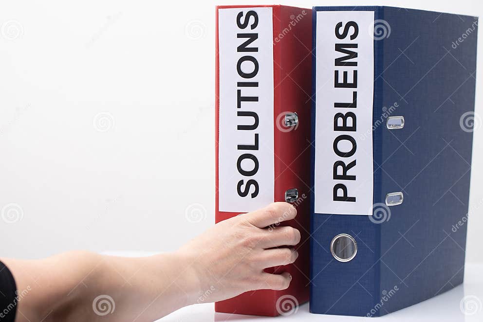 Problems and Solutions - Two Binders with Text on Desk in the Office ...