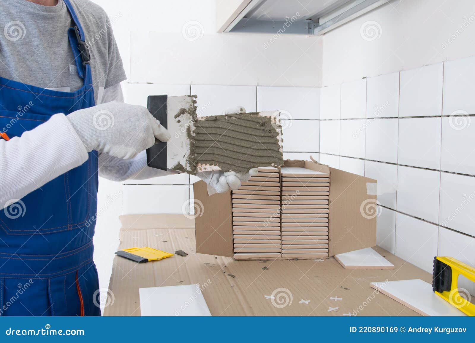 The Process of Applying the Adhesive Solution with a Metal Spatula on ...