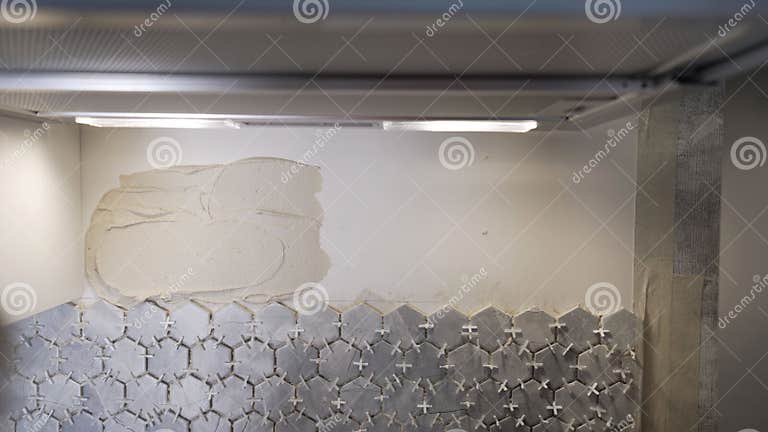 The Process of Applying the Adhesive Solution with a Metal Spatula on ...