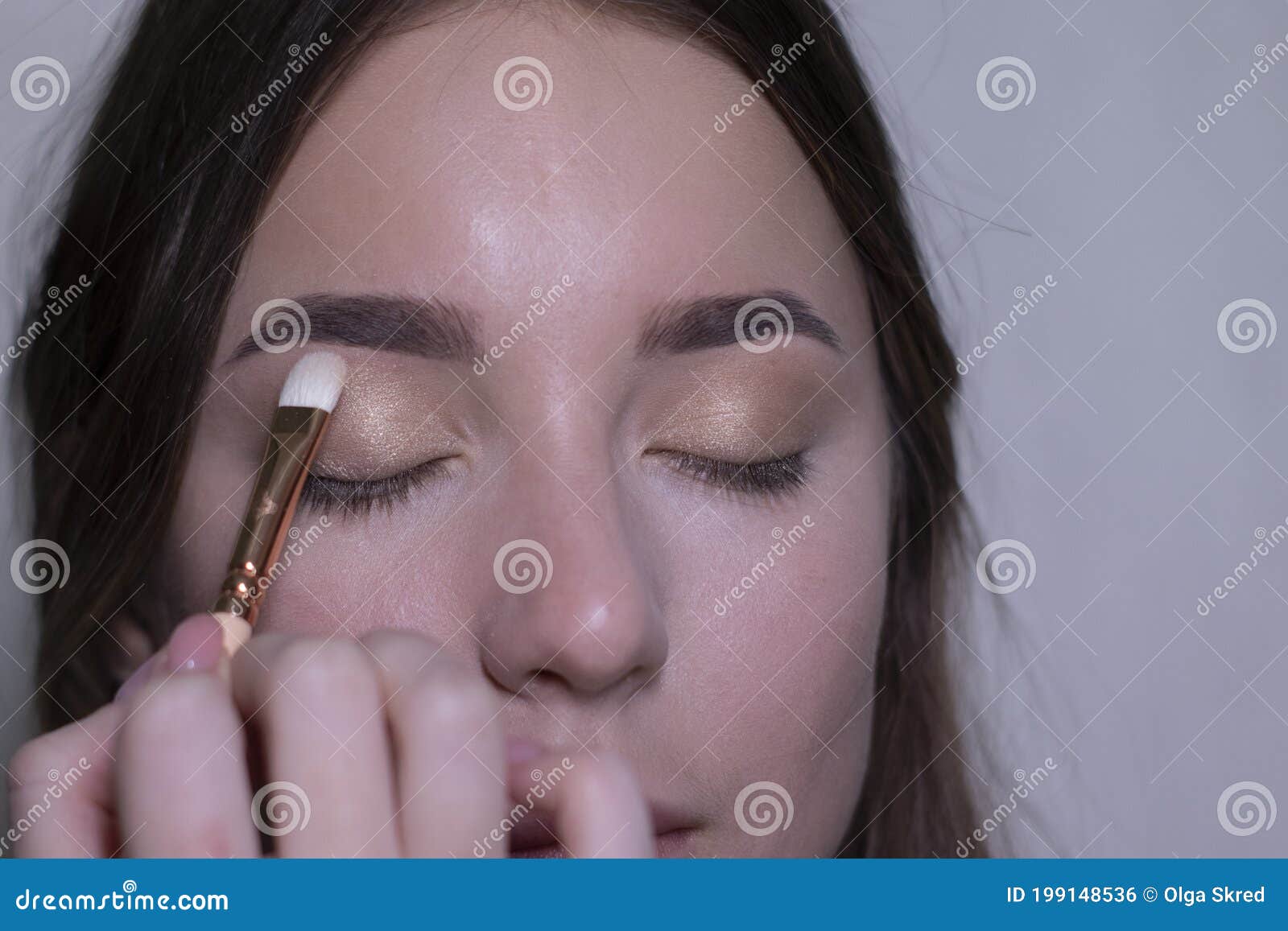 The Process of Applying Makeup To a Beautiful Brunette. Beauty ...