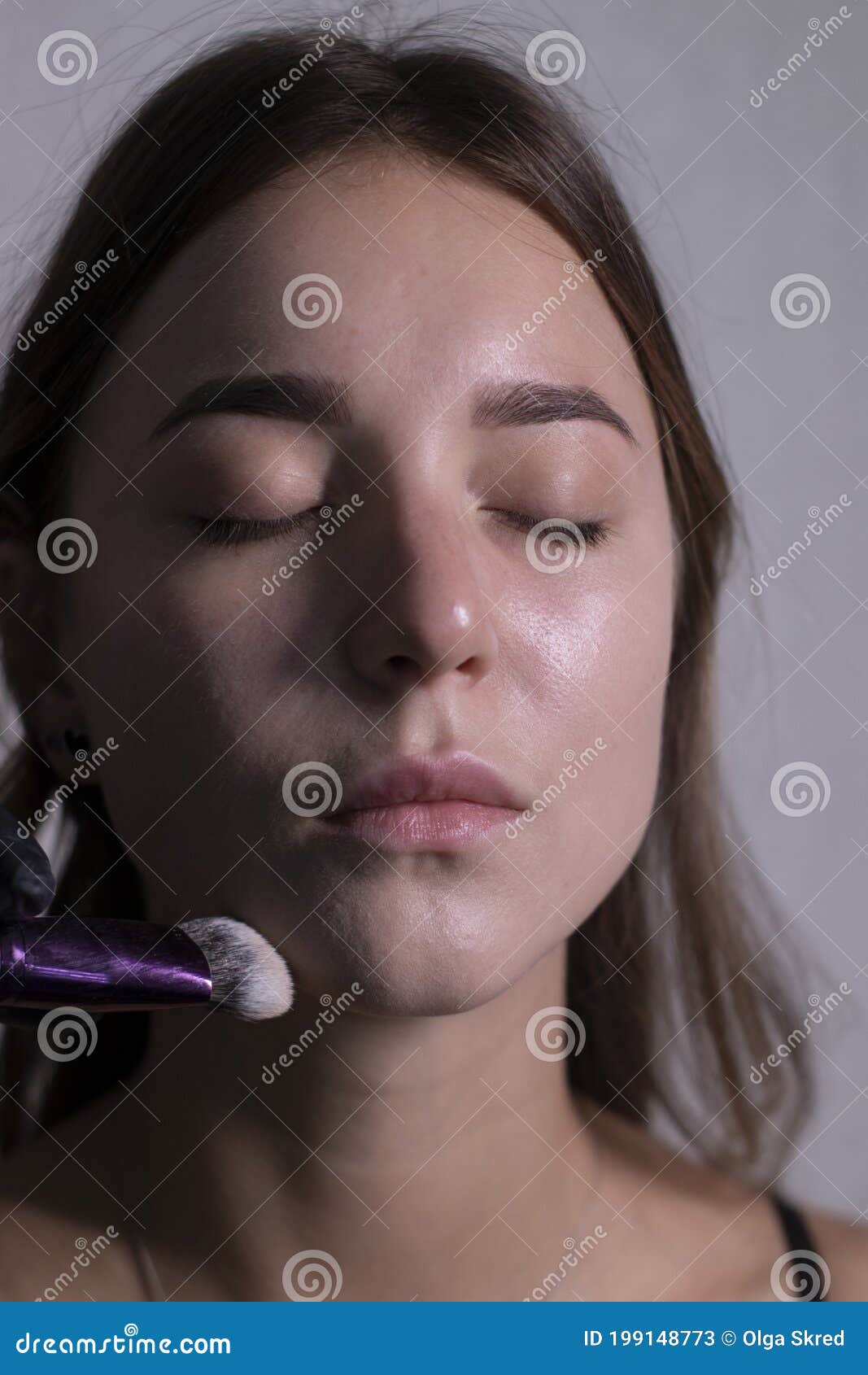 The Process of Applying Makeup To a Beautiful Brunette. Beauty ...
