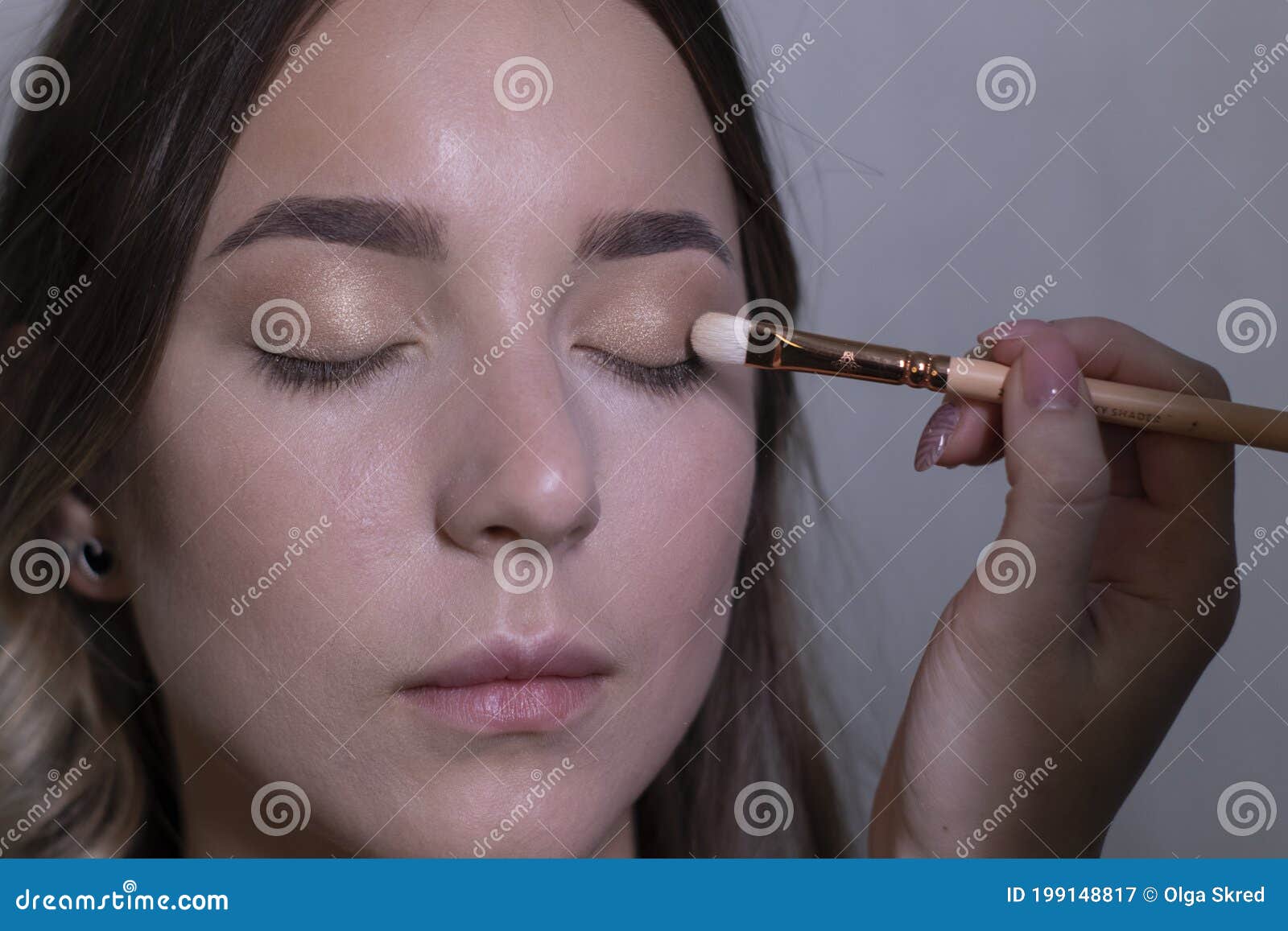 The Process of Applying Makeup To a Beautiful Brunette. Beauty ...