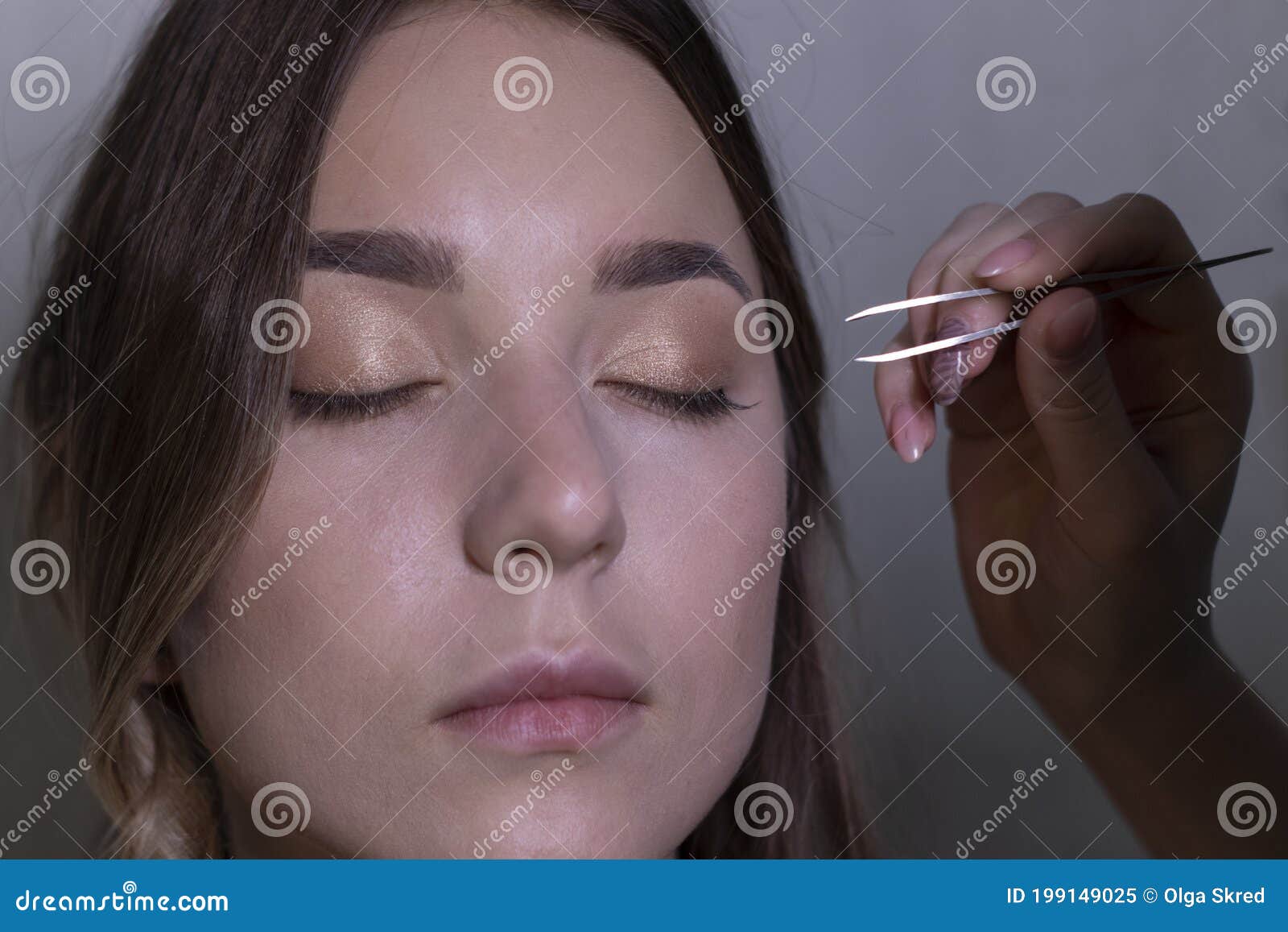 The Process of Applying Makeup To a Beautiful Brunette. Beauty ...