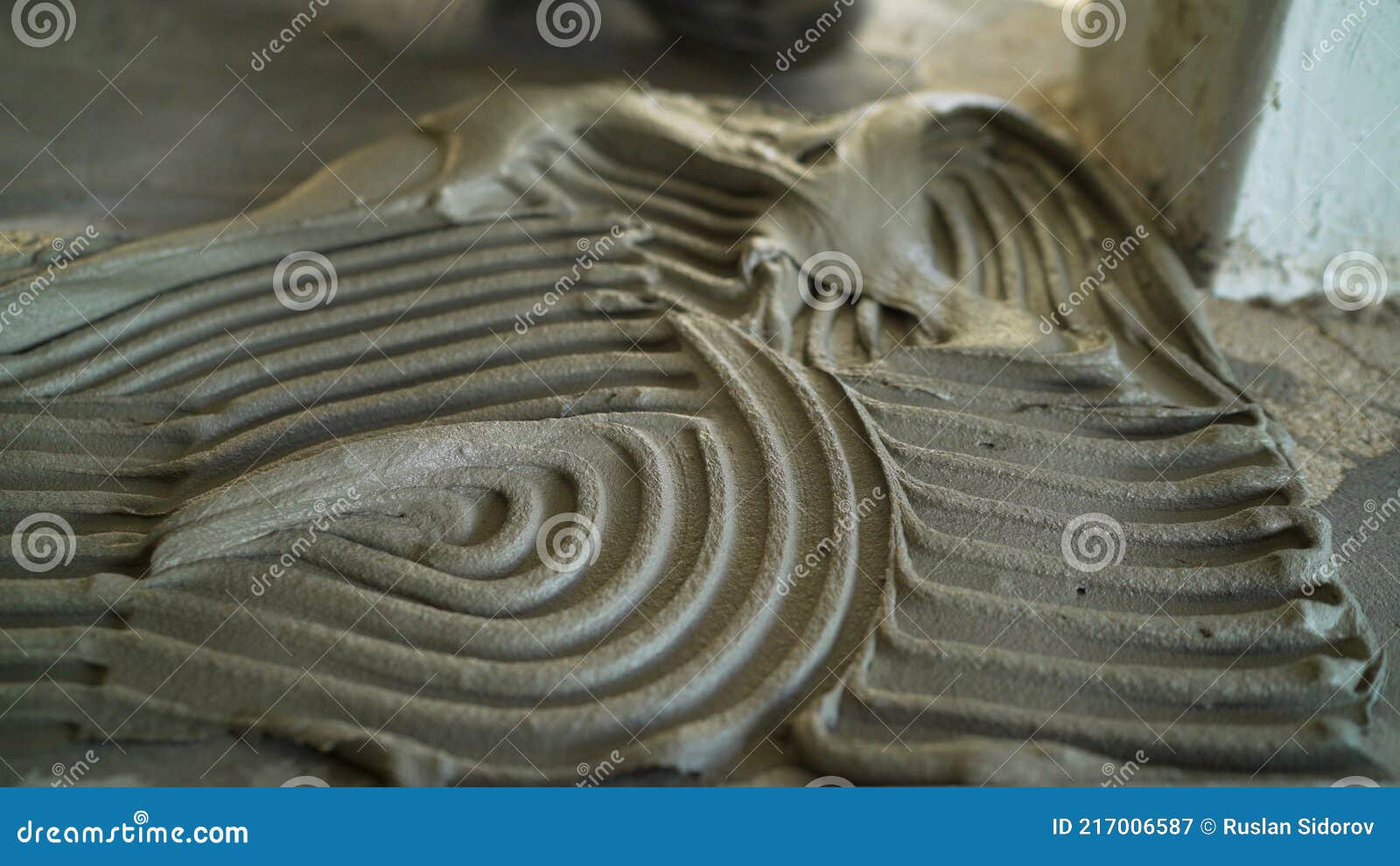 The Process of Applying Mortar for Laying Ceramic Tiles. Leveling ...