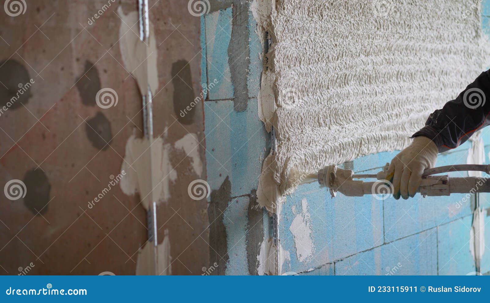 The Process Of Applying Mortar To The Wall Using A Hose. A Builder ...