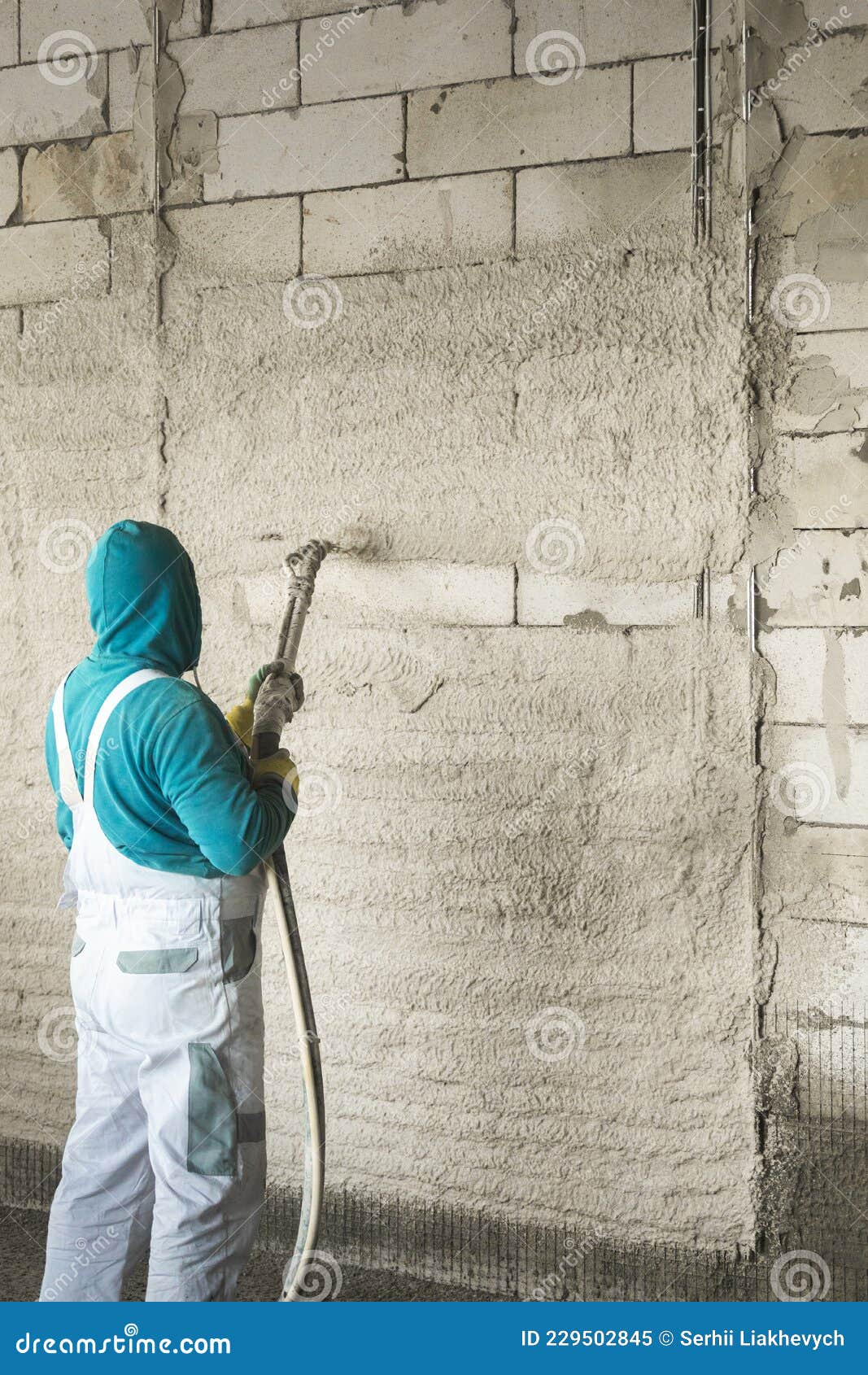 The Process of Applying Plaster To Walls Inside a Building by Machine ...