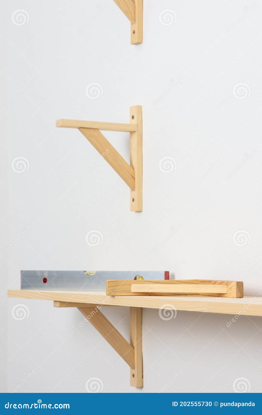 The Process of Attaching a Wooden Shelf To the Wall Stock Photo - Image ...