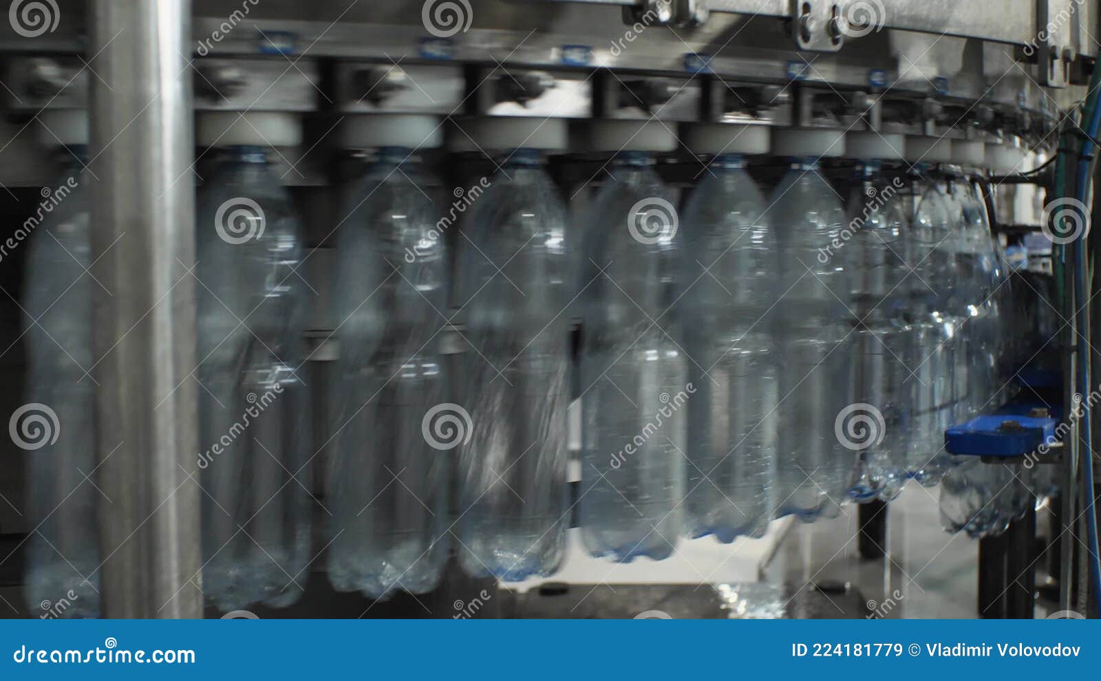 The Process of Automatic Filling of Water in a Plastic Bottle with a ...