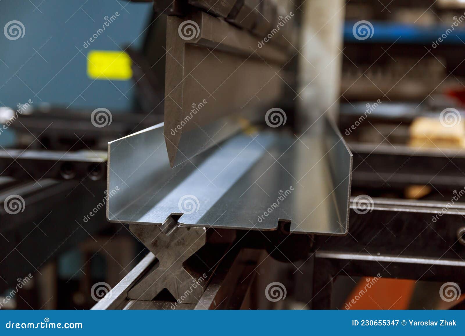 The Process of Bending Metal Parts on a Modern Bending Machine. Long ...
