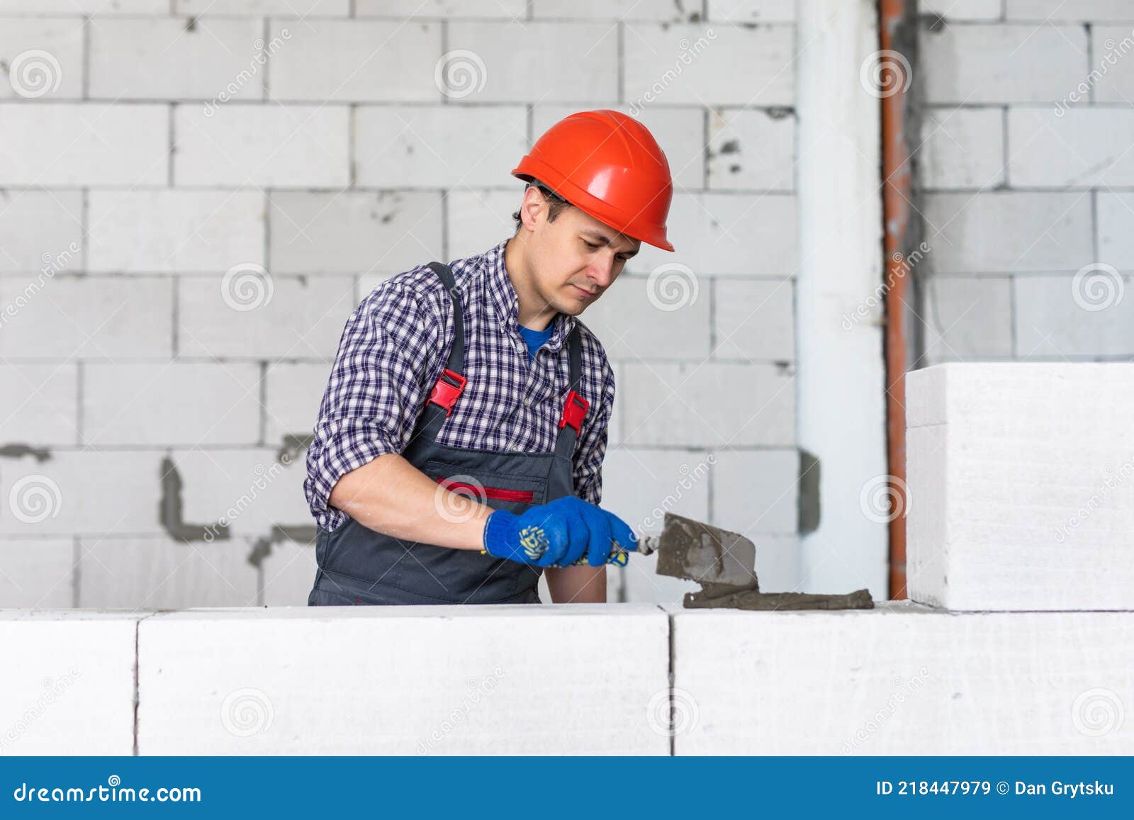 Process Of Bricklaying. Mason Hands Installing Aerated Concrete Wall ...
