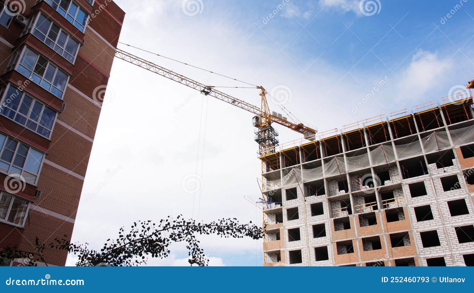 Construction of an Apartment Building. the Work of a Construction Crane ...