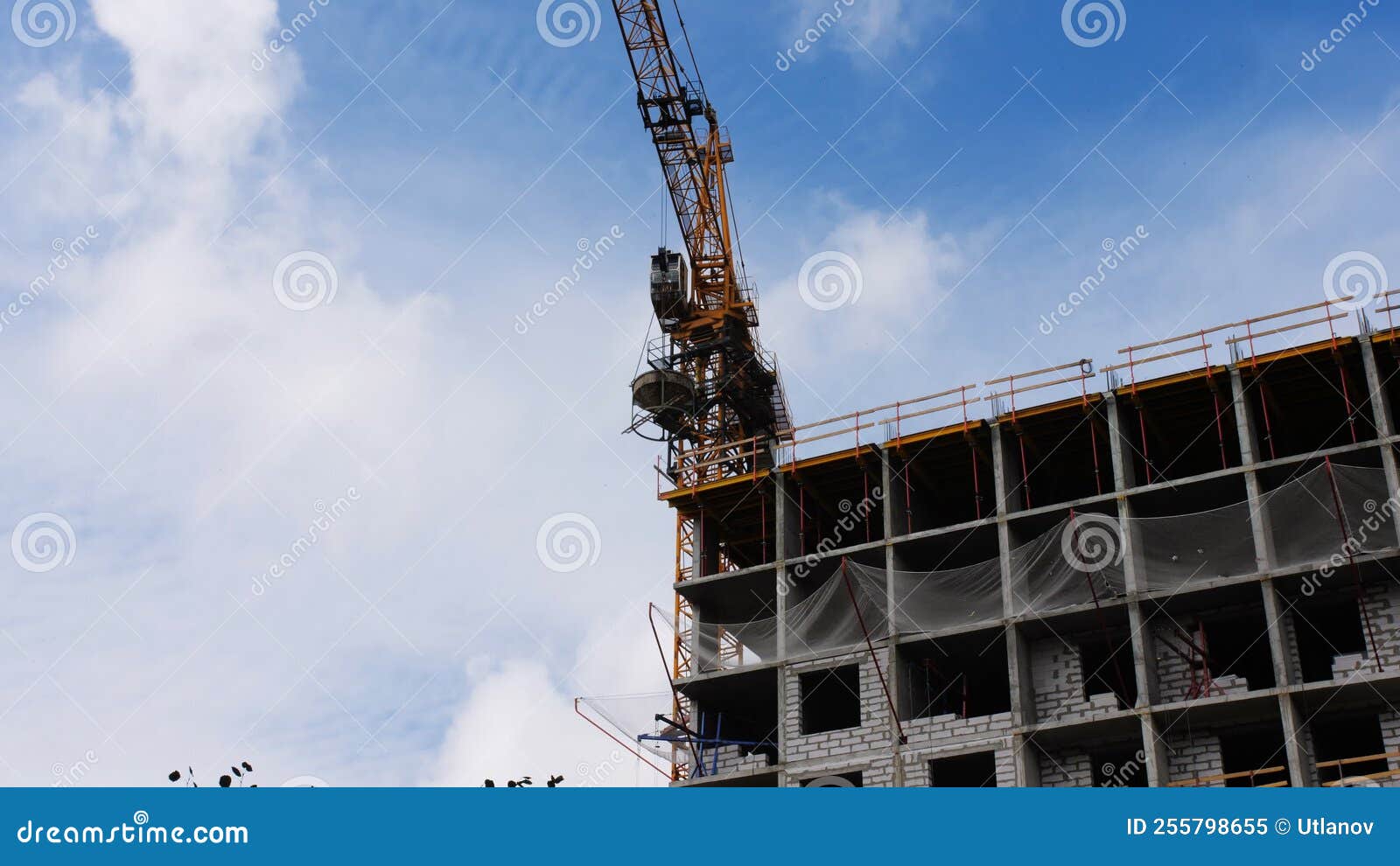 The Work of a Construction Crane on a Construction Site during the ...