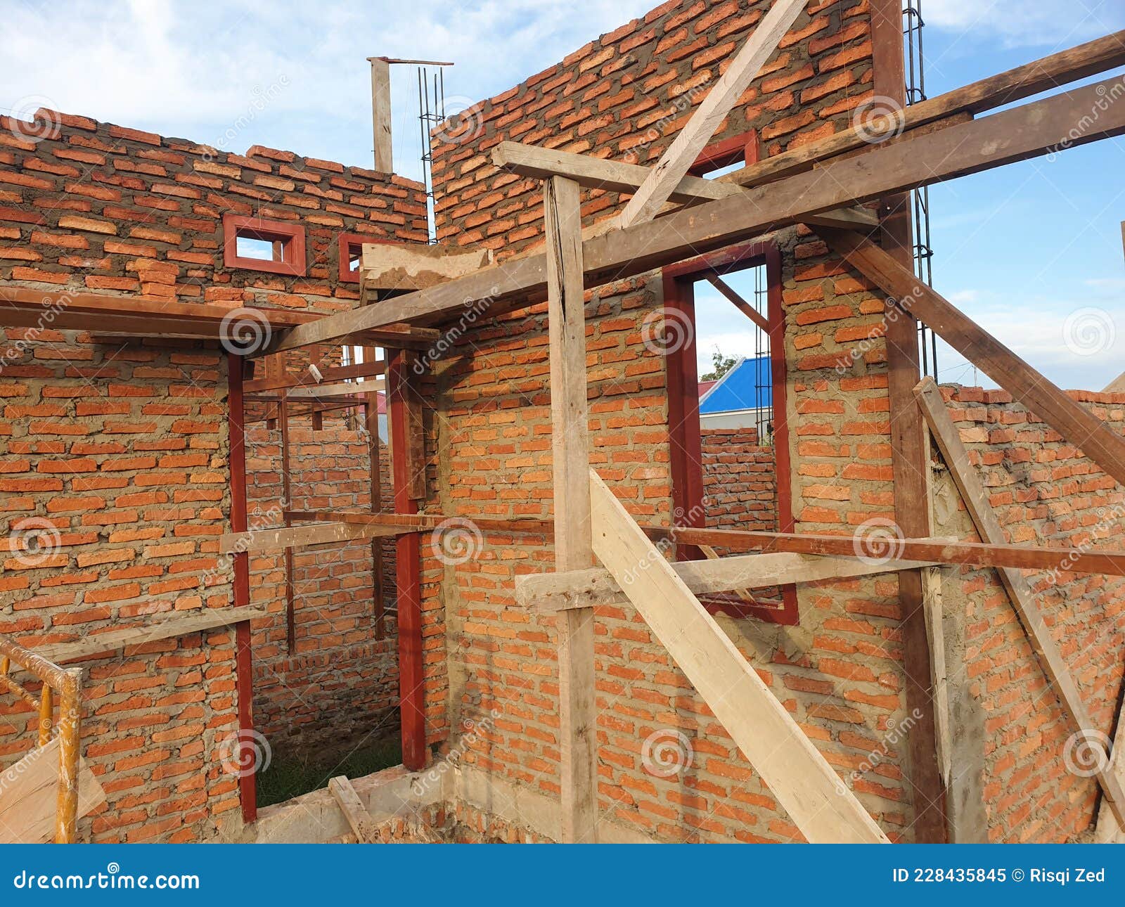 The Process of Building a House Using Red Stone or Brick Stock Image ...