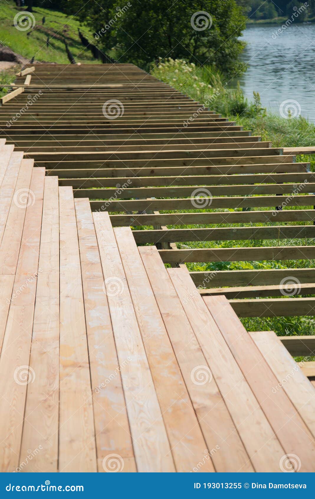 The Process of Building a Wooden Deck by the River. the River, the Work ...