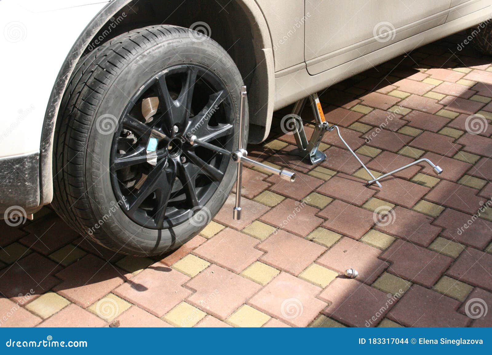 Process of Changing Wheels on a Car. Tire Fitting Editorial Stock Image ...