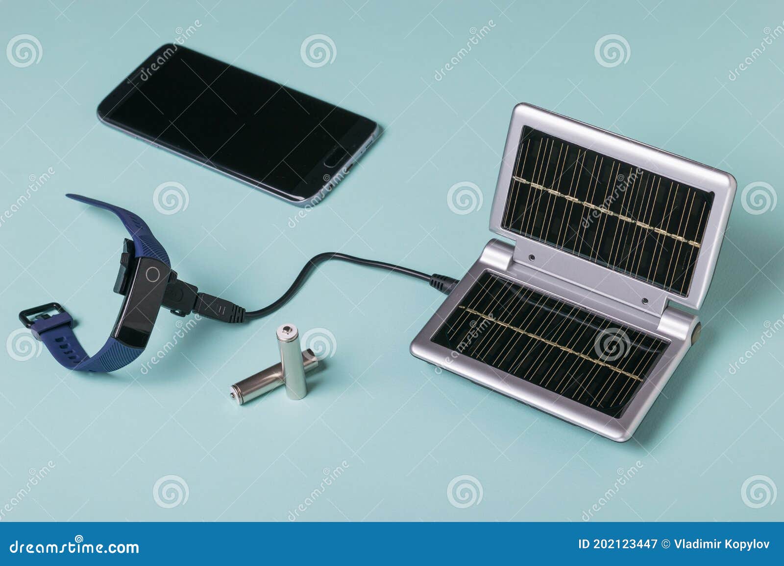 The Process of Charging a Smart Watch from Solar Panels. Use of Solar ...
