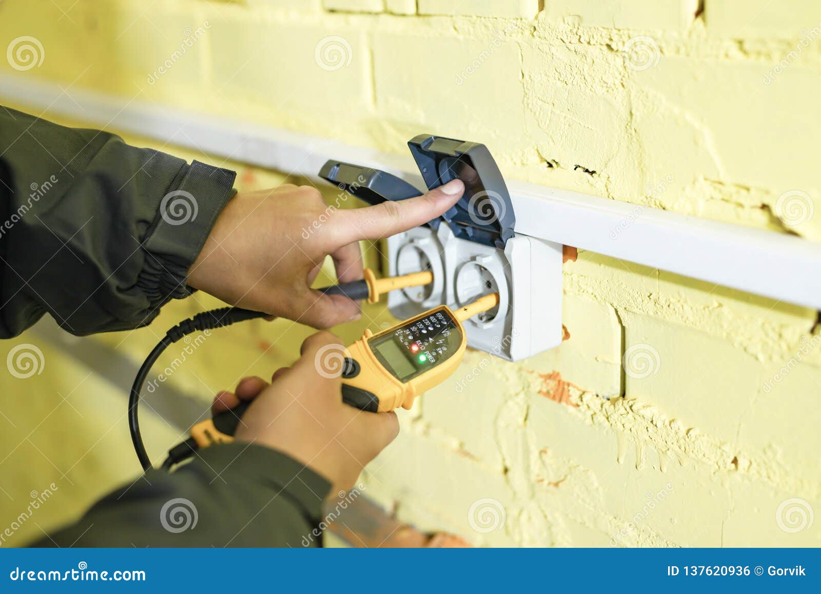 The Process of Checking the Connection of Cables To a Dual Outlet Stock ...