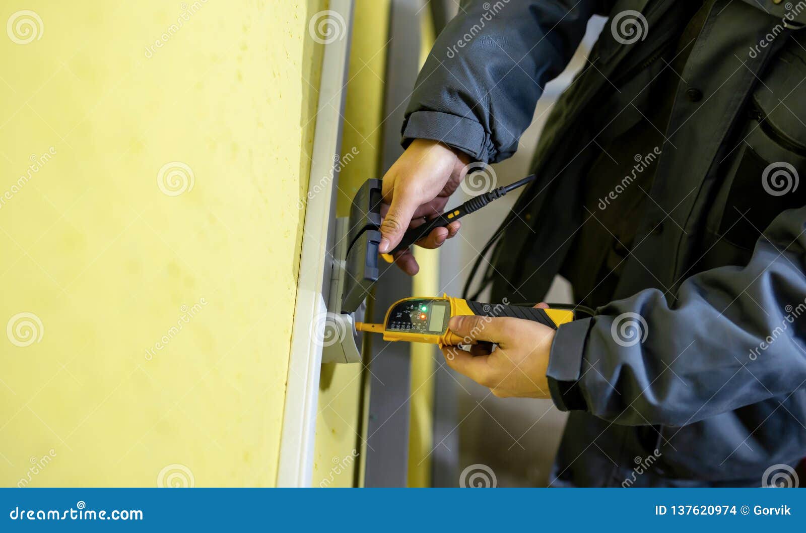 The Process of Checking the Connection of Cables To a Dual Outlet Stock ...