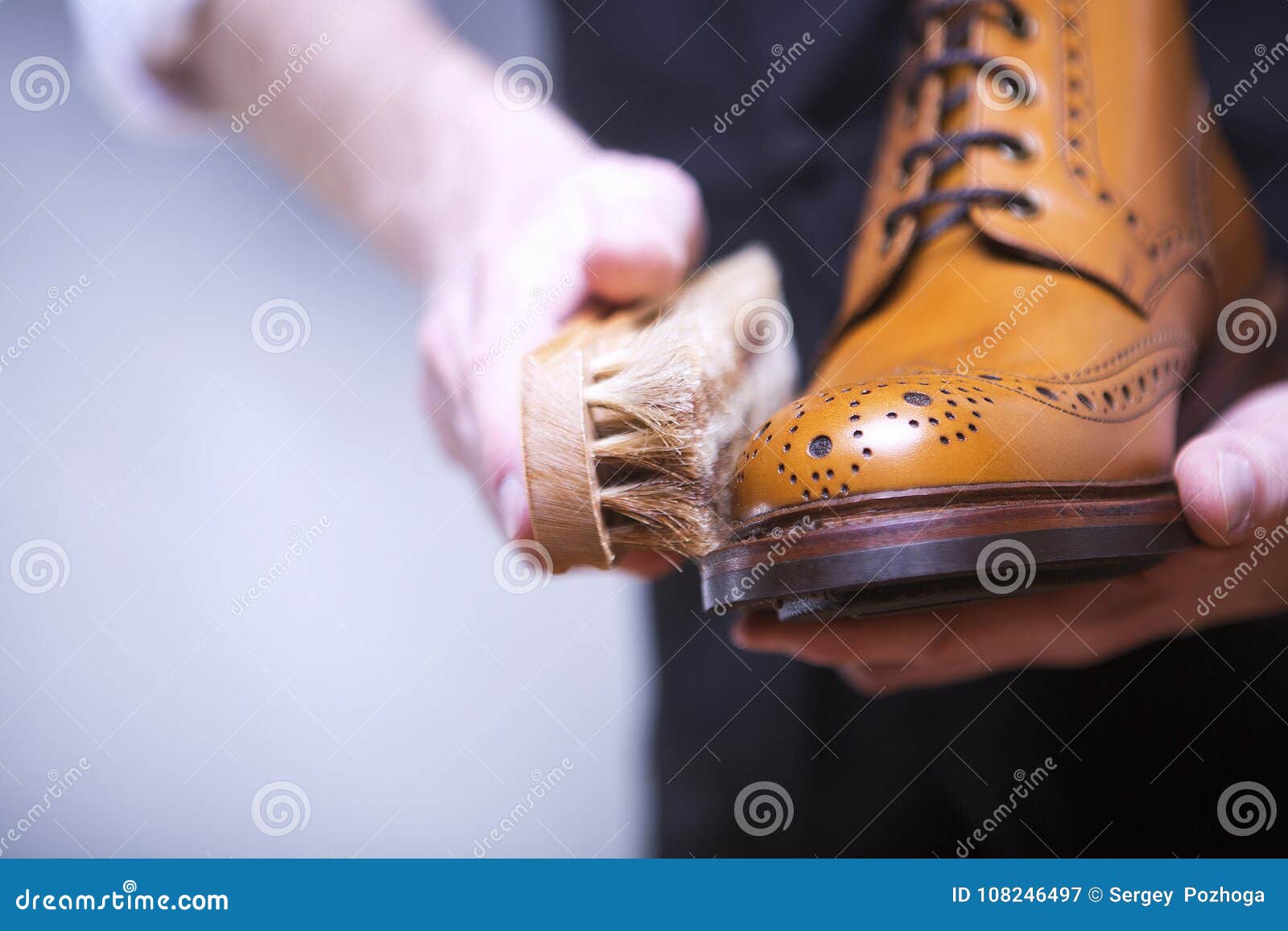 The Process of Cleaning Shoes. a Man is Cleaning His Shoes Stock Image ...