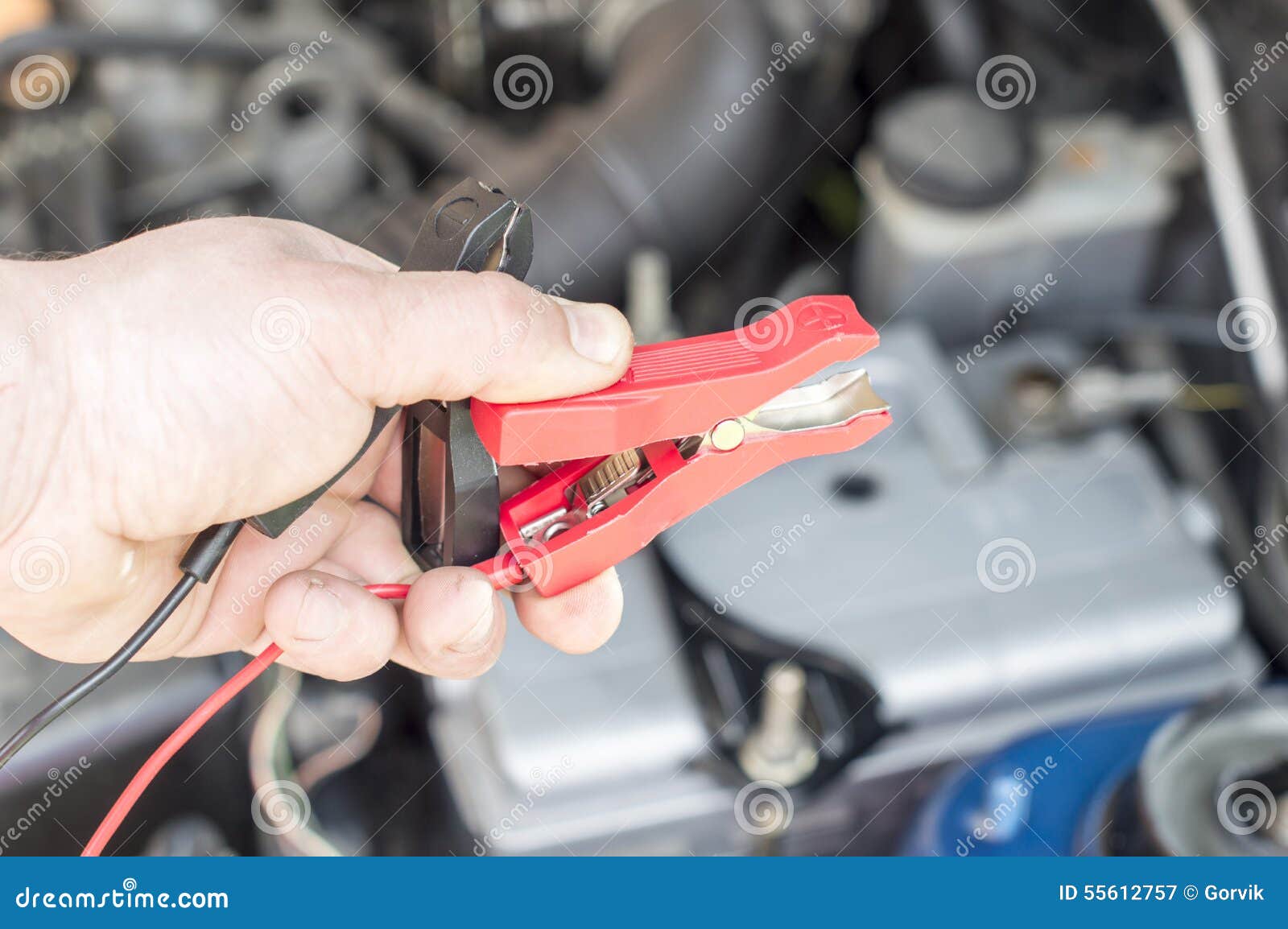 The Process of Connecting the Charger To the the Vehicle Battery Stock ...