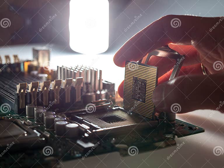 The Process of Connecting the CPU To the Processor Socket on a Modern Computer Motherboard ...