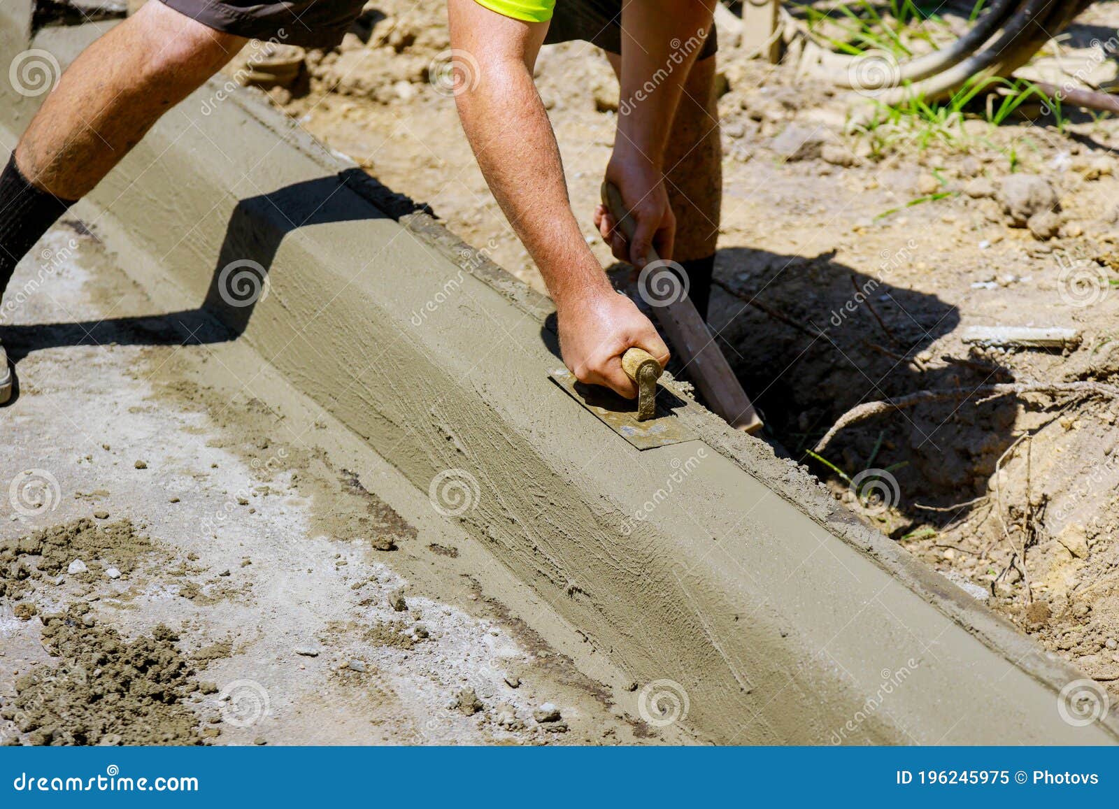 Construction Of A Sidewalk Walkway From Concrete Paving Slabs Next To A ...