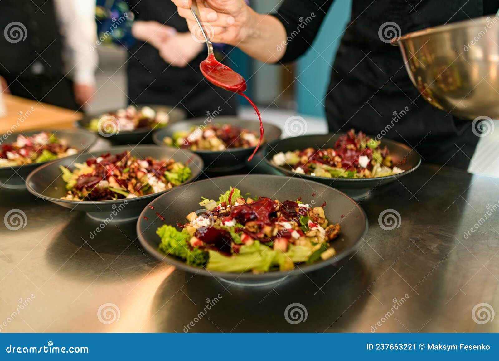 Process of Cooking Dish - Adding Red Sauce To Plates with Salad Stock ...