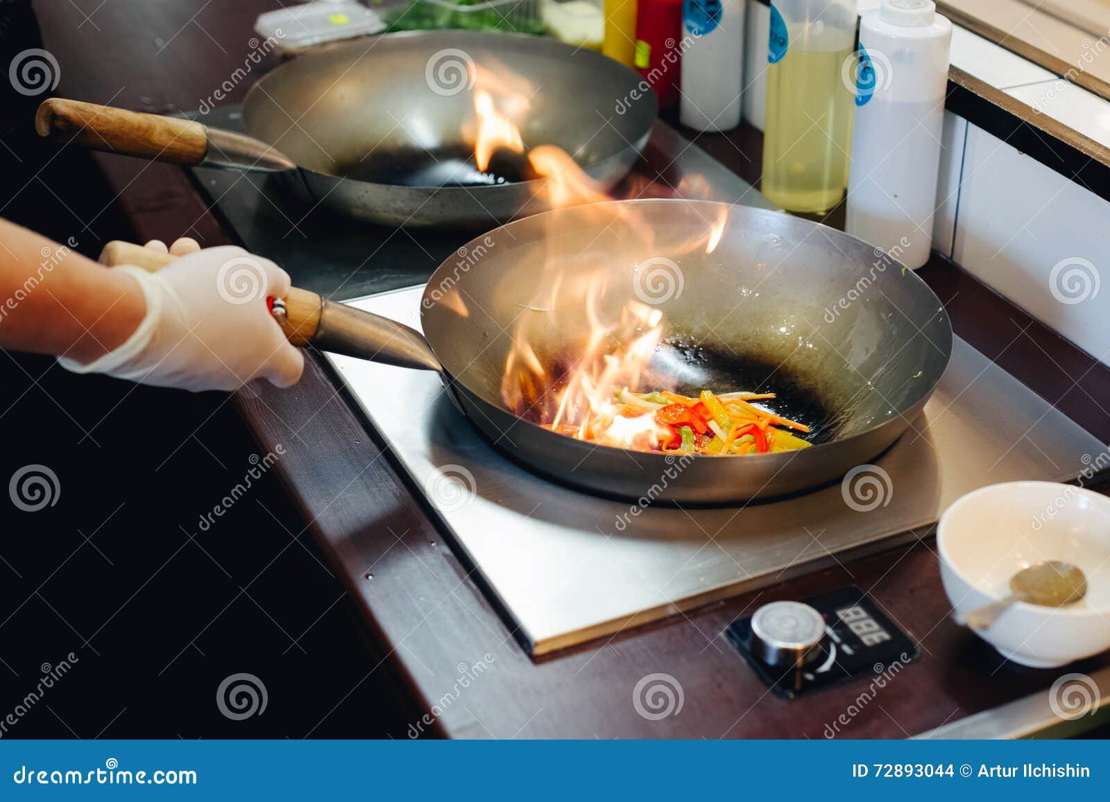 Process of Cooking on Fire Wok Dish in Deep Pan. Stock Photo - Image of ...
