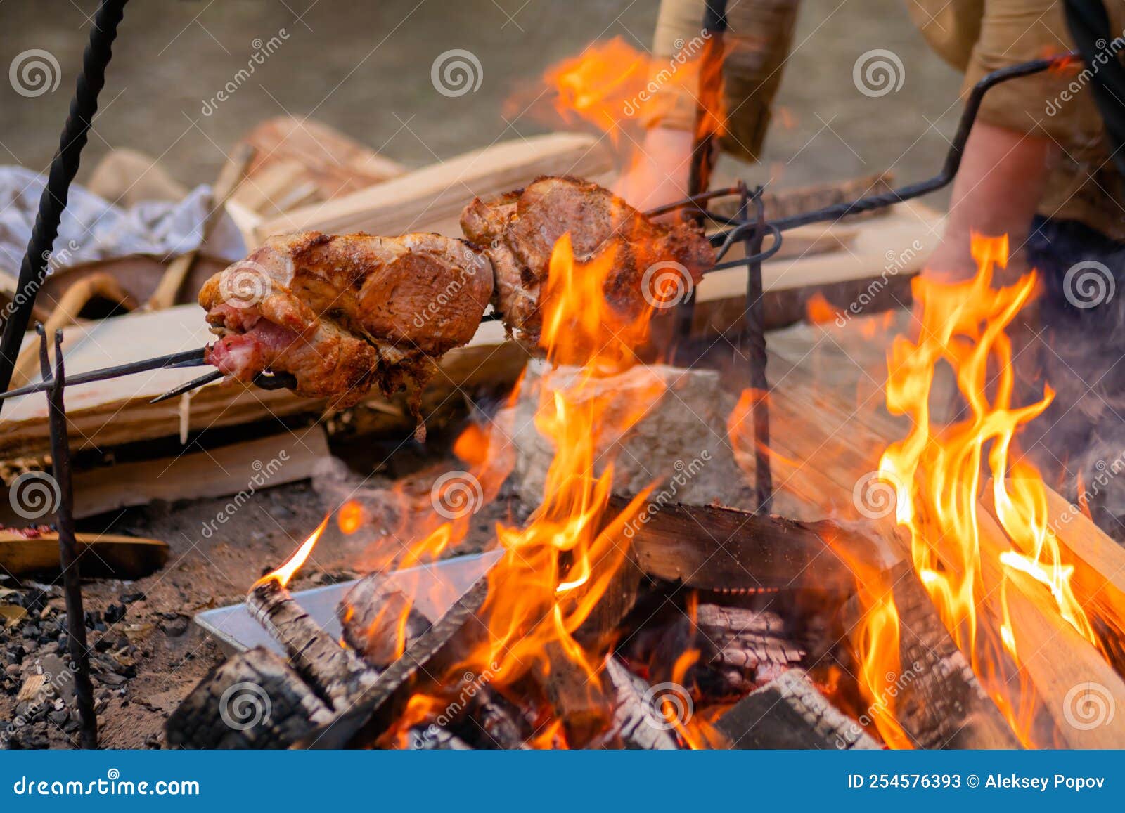 Process of Cooking Large Meat Peaces on Spit Over Open Fire Stock Image ...