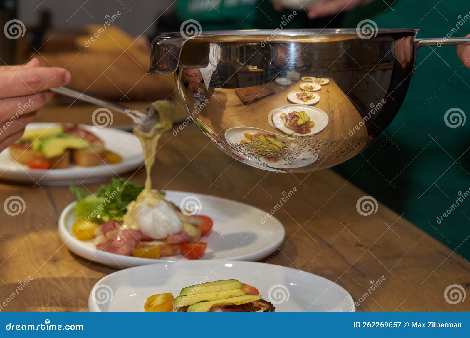 The Process of Cooking: Laying Out the Finished Dish on Plates Stock ...