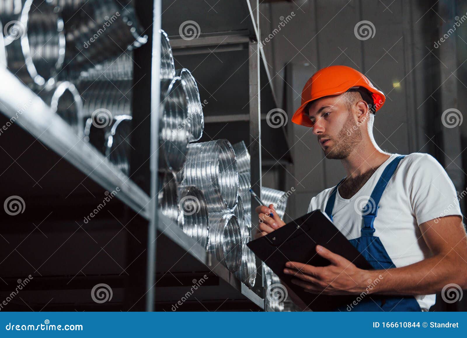 Process of Counting. Man in Uniform Works on the Production Stock Photo ...