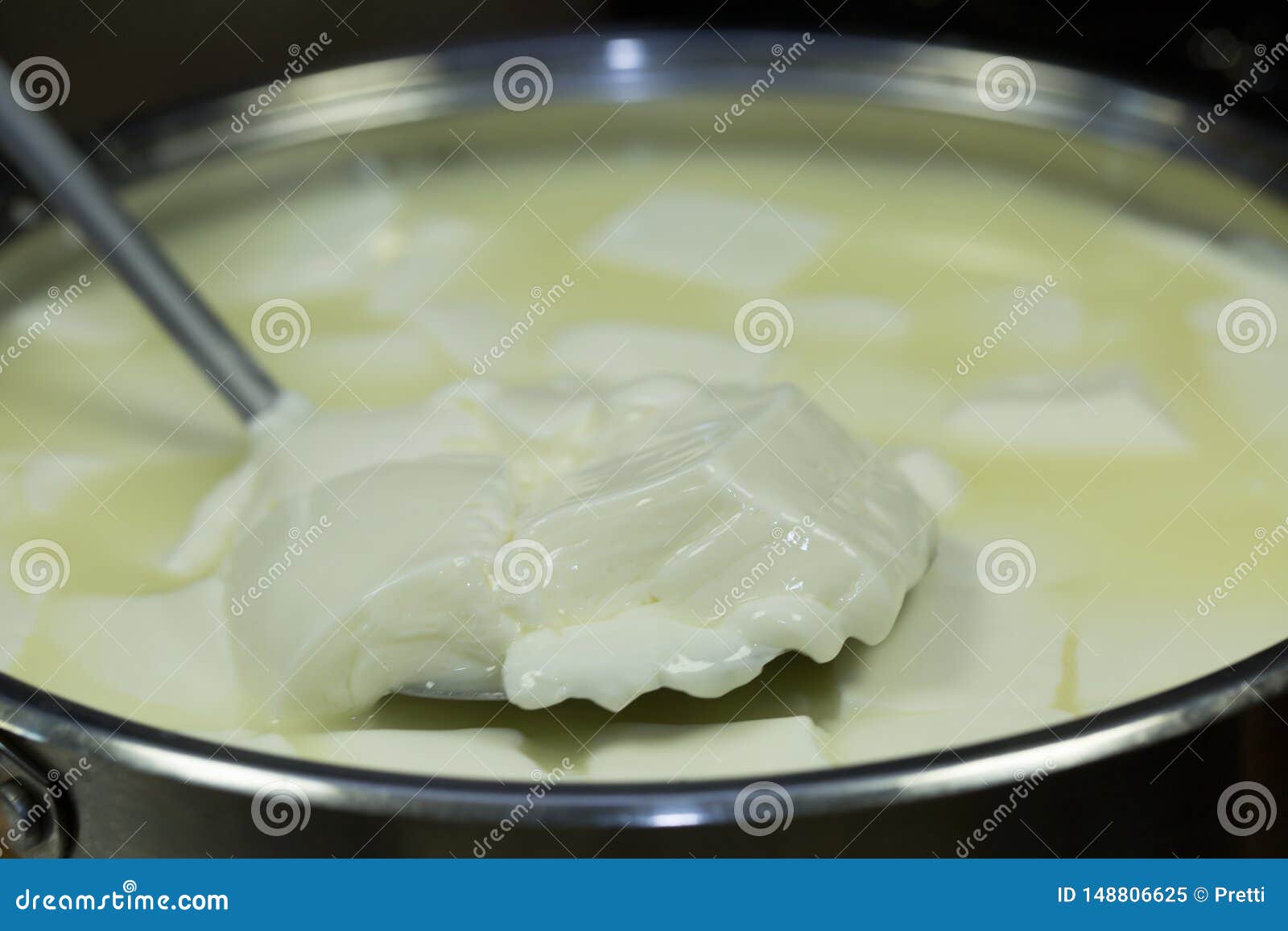 The Process of Creating a Grain of Cheese. Cooking Homemade Cheese ...