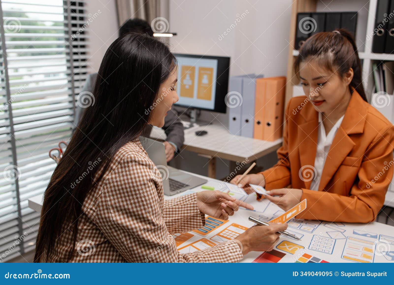 Ux Developer And Ui Designer Presenting Mobile App Interface Design On