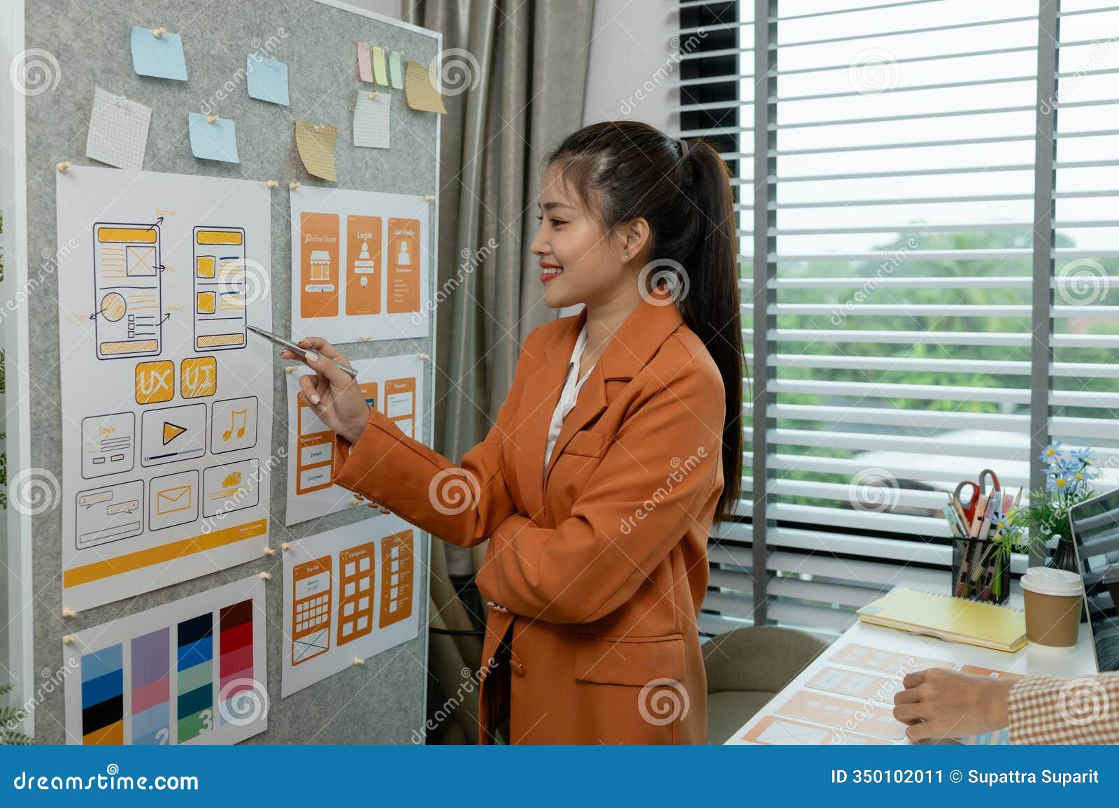 Ux Developer And Ui Designer Presenting Mobile App Interface Design On